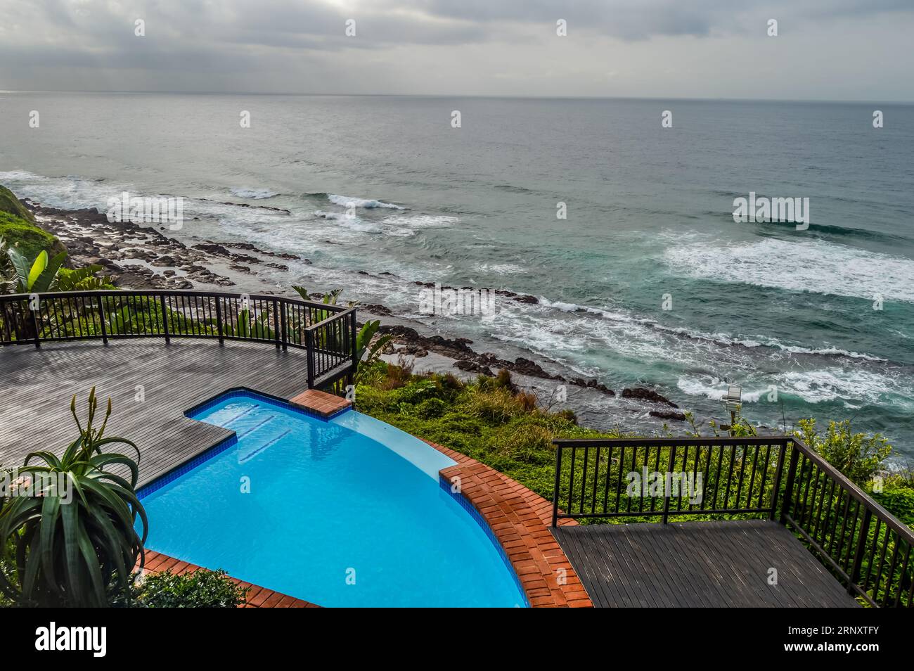 Outdoor jacuzzi and luxurious spa bath and infinity pool along Atlantic ...
