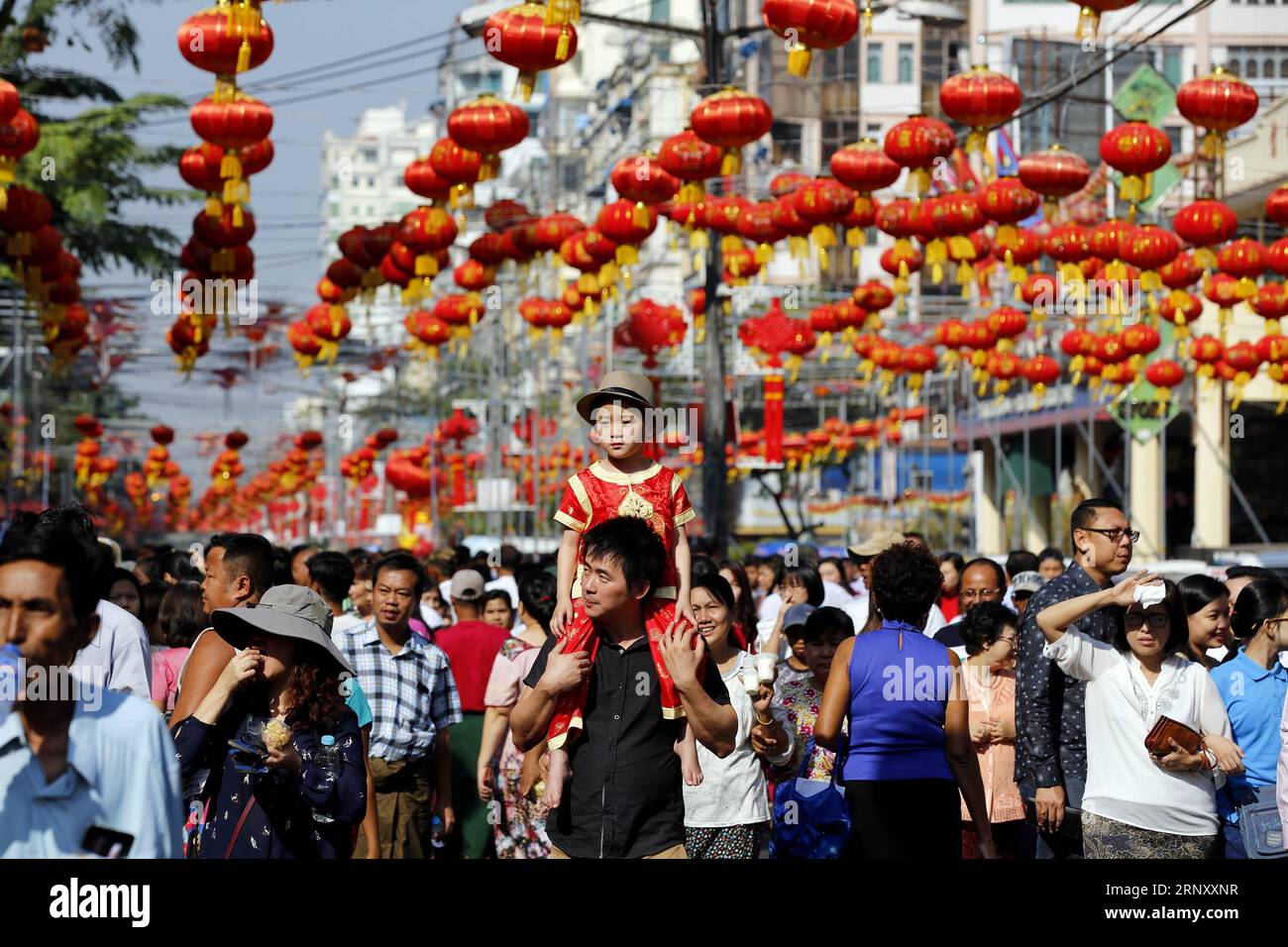 (180216) -- , Feb. 16, 2018 -- A boy sits on his father s shoulders as ...
