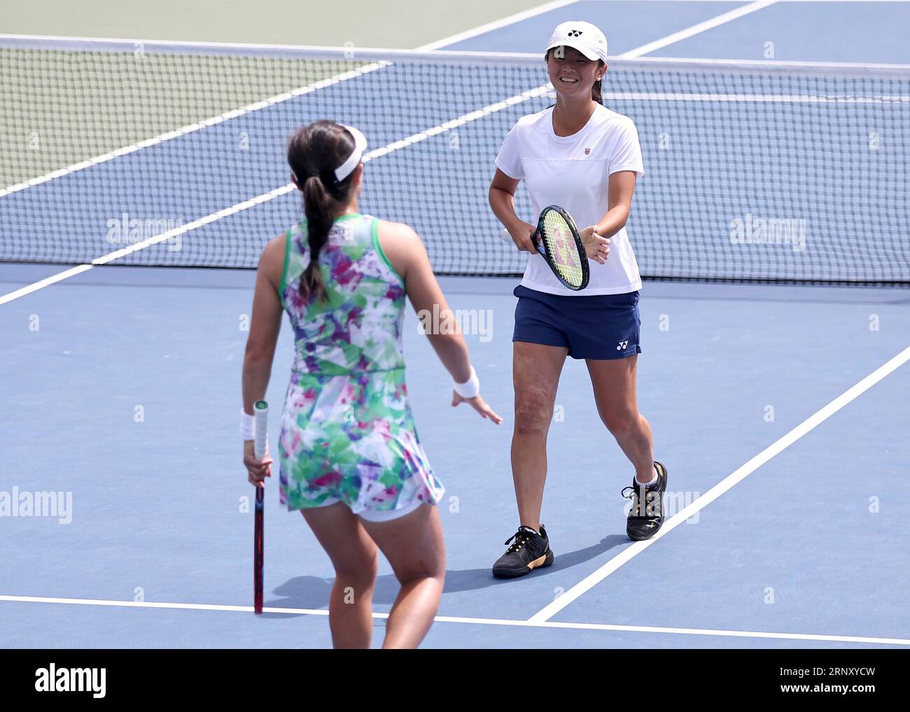 Fang-Hsien Wu reacts with Lin Zhu during a women's doubles match at the ...