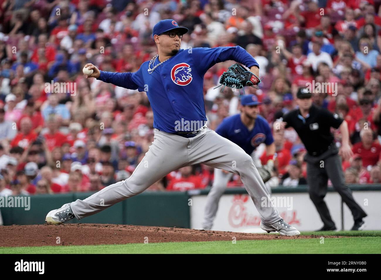 Chicago Cubs starting pitcher Javier Assad delivers to a Cincinnati ...
