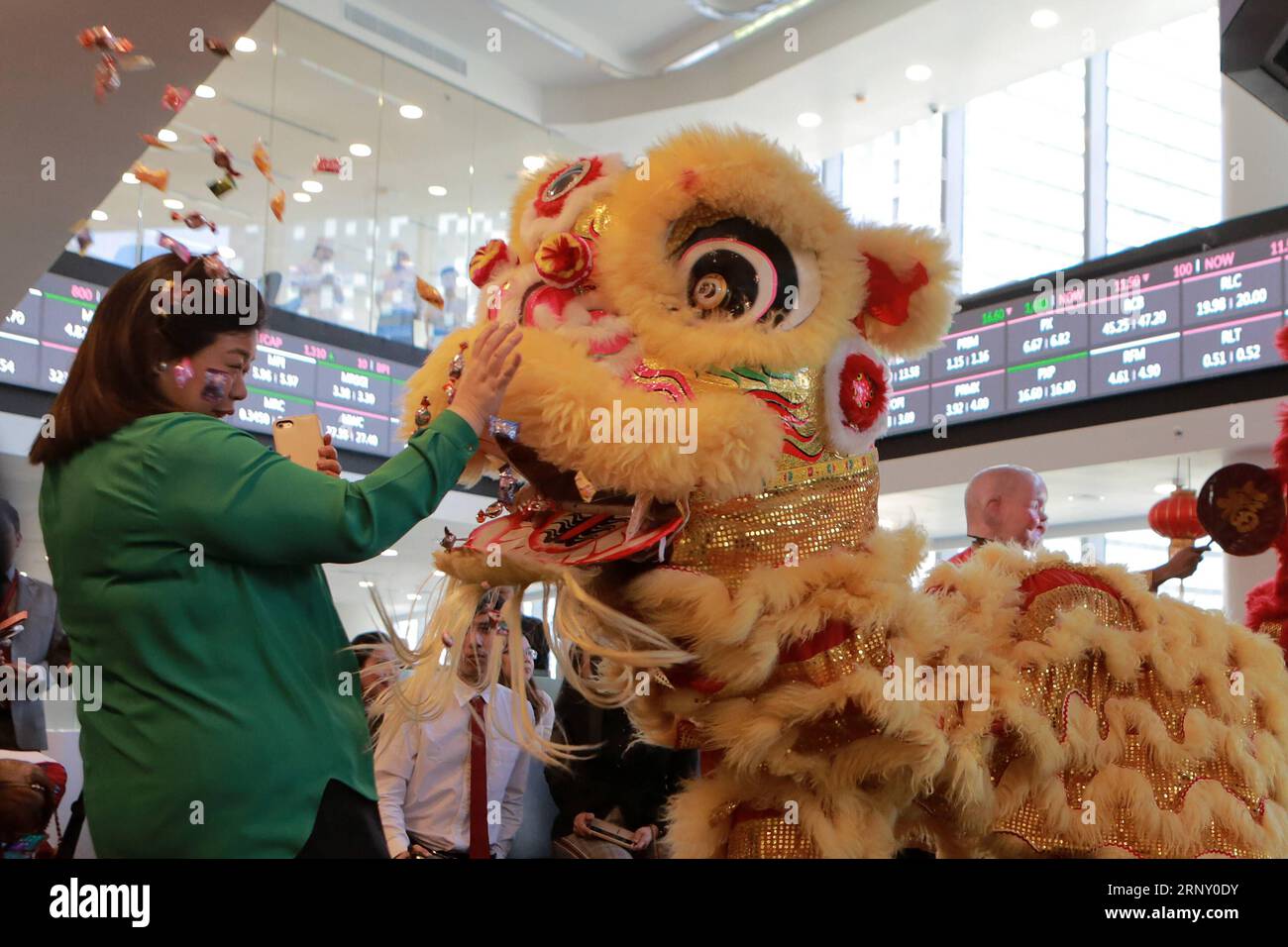 (180219) -- TAGUIG CITY, Feb. 19, 2018 -- A trader is showered with ...