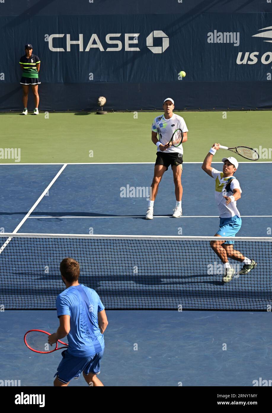 Mackenzie McDonald and Andreas Mies in action during a men's doubles ...