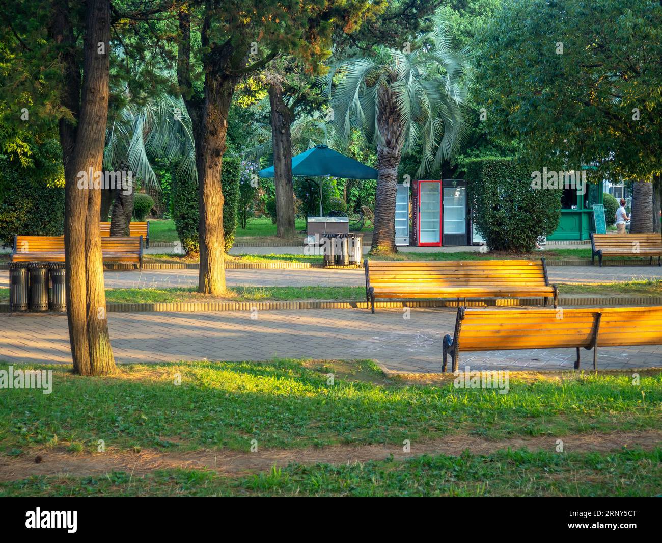Park area with benches. Small business at the resort in the park. Place ...