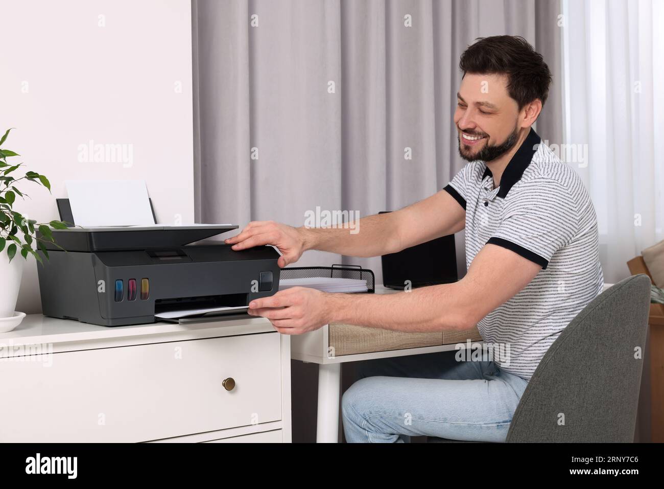 Person using printer at home hi-res stock photography and images - Alamy