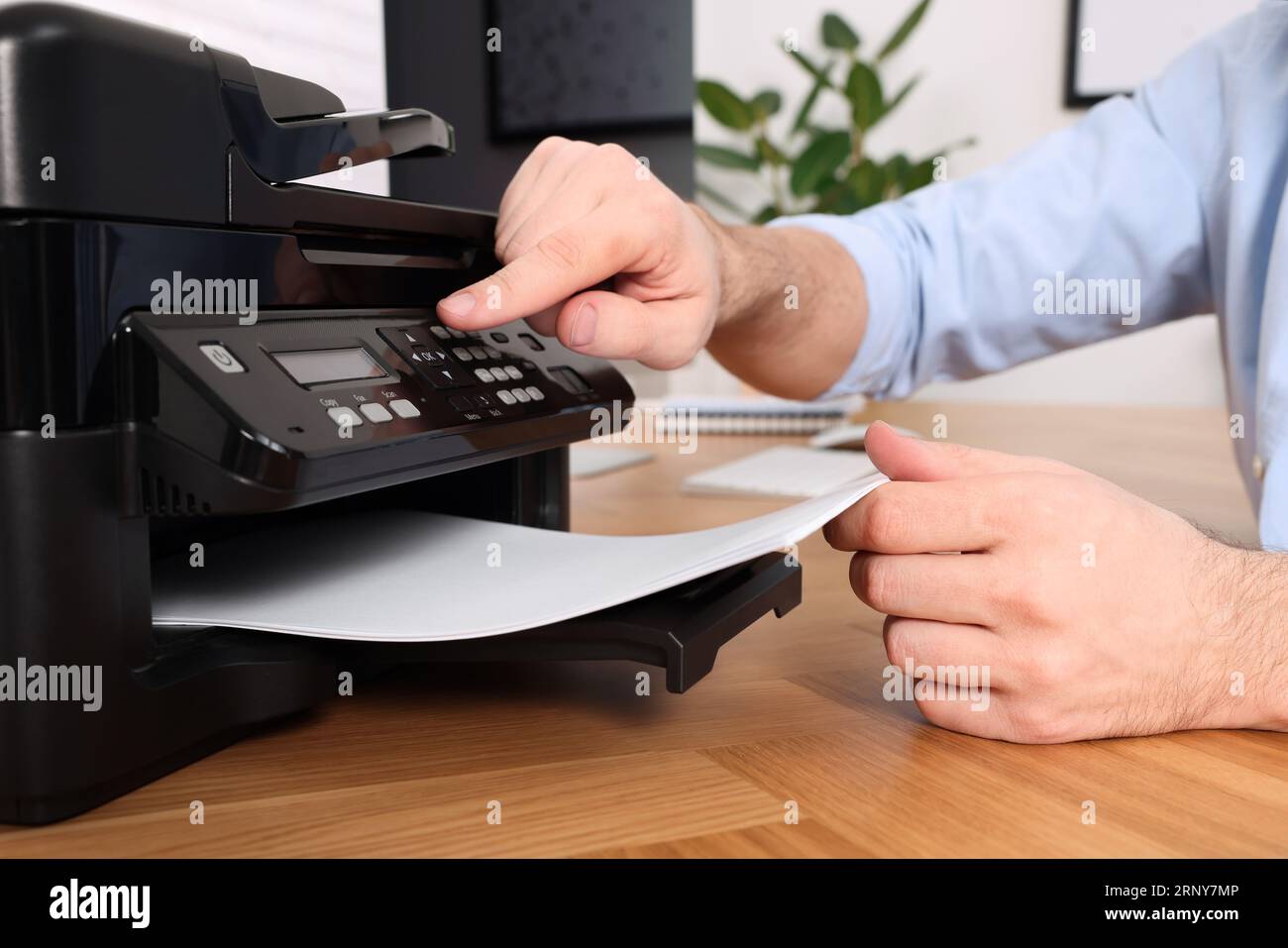 Person using black printer at home hi-res stock photography and images ...