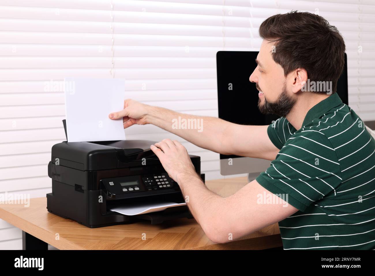 Person using black printer at home hi-res stock photography and images ...