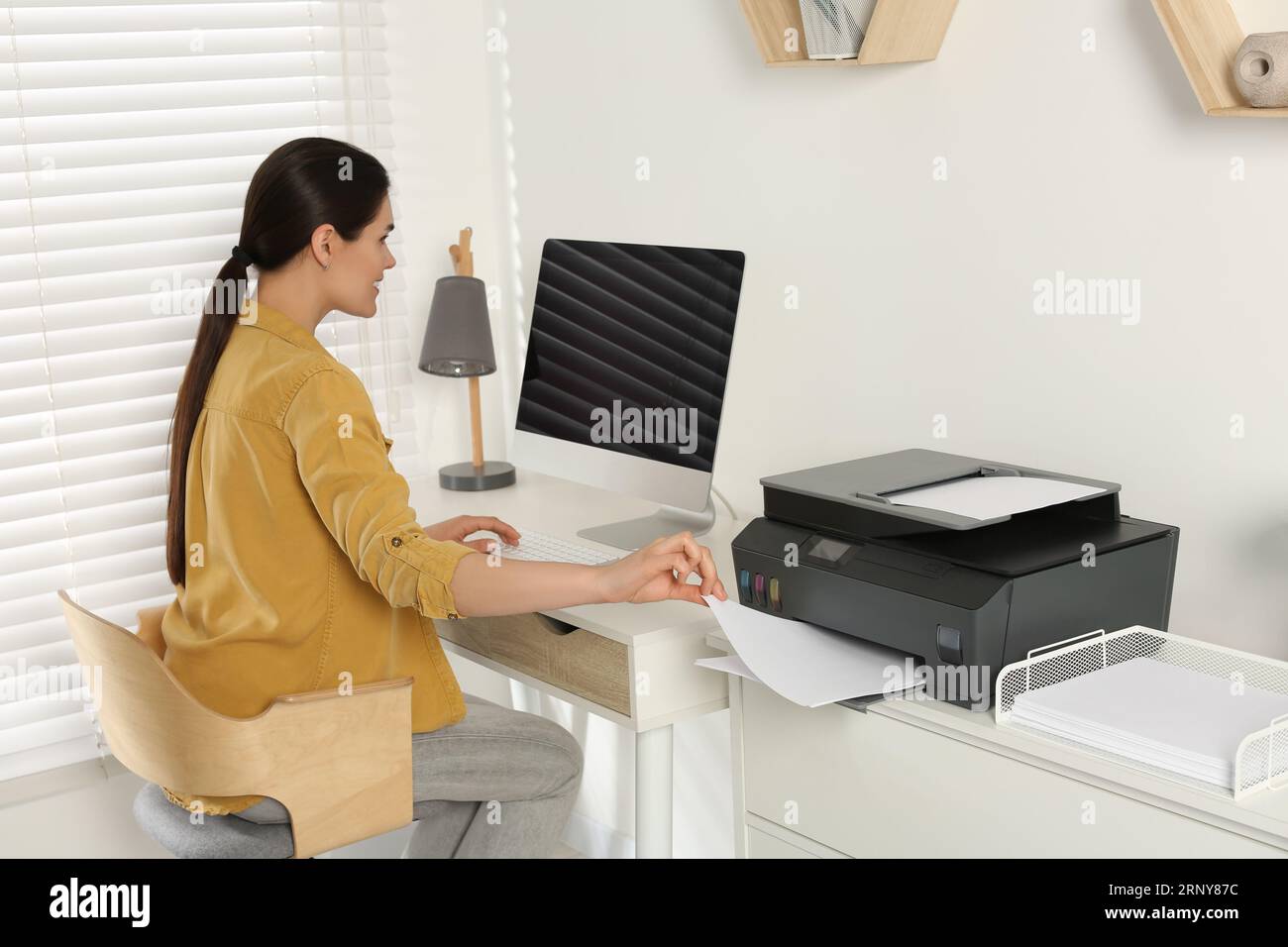 Person using printer at home hi-res stock photography and images - Alamy