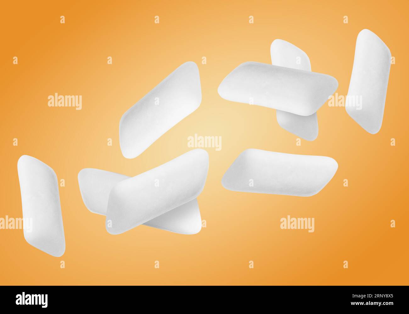 Many chewing gum pads falling on orange background Stock Photo - Alamy