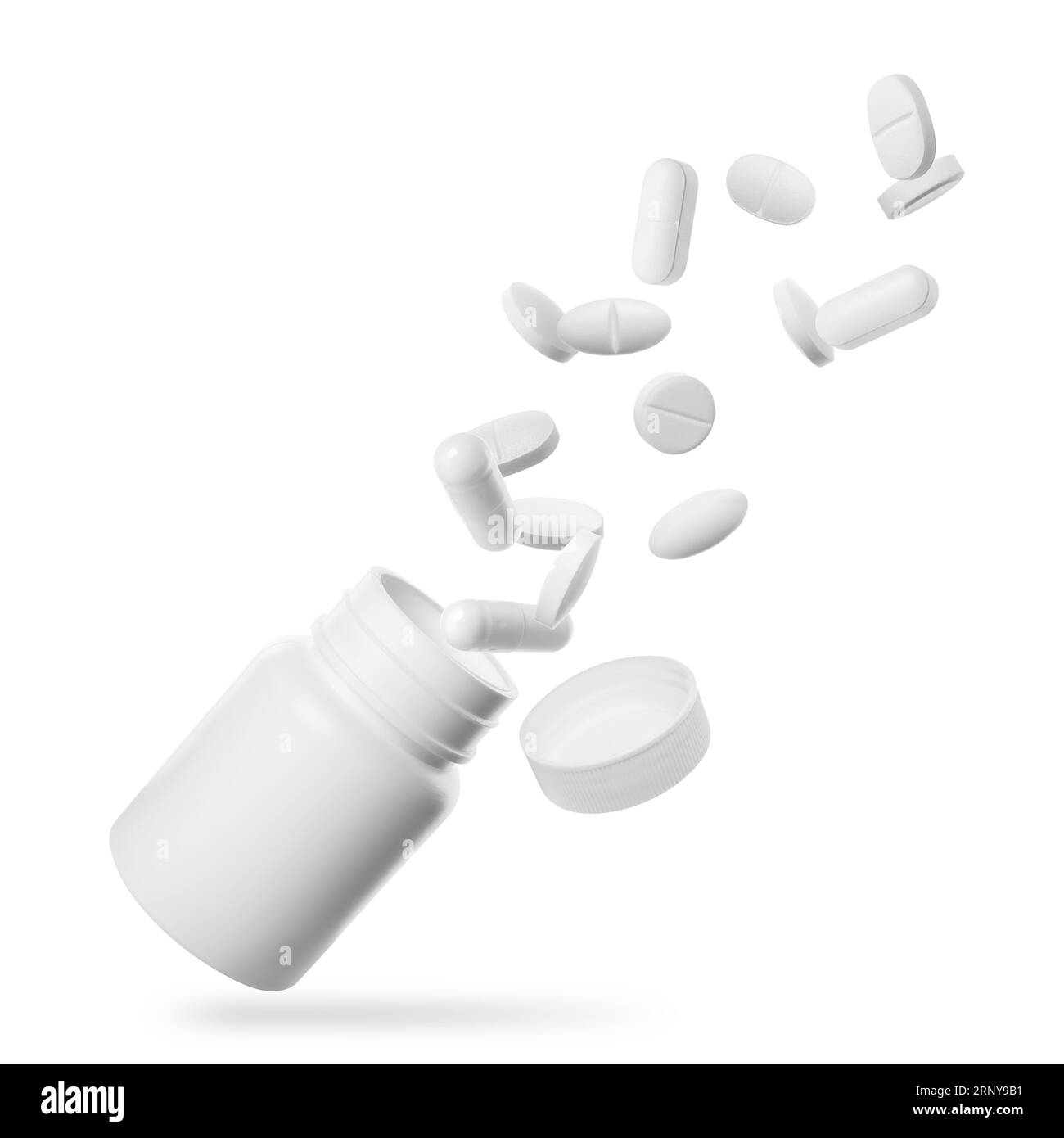 Many different pills falling into bottle on white background Stock ...