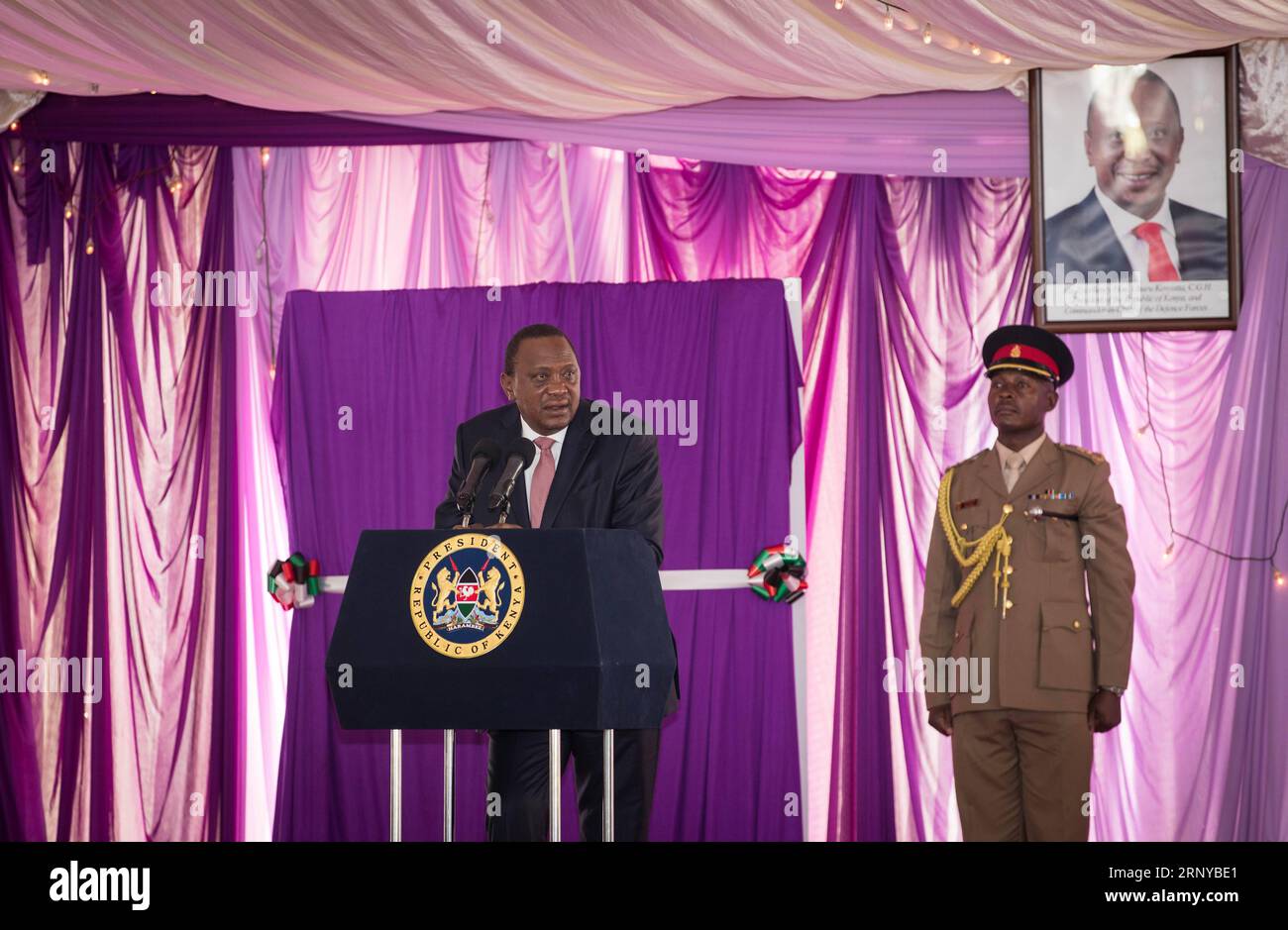 (180308) -- NAIROBI, March 8, 2018 -- Kenyan President Uhuru Kenyatta (L) delivers a speech ...