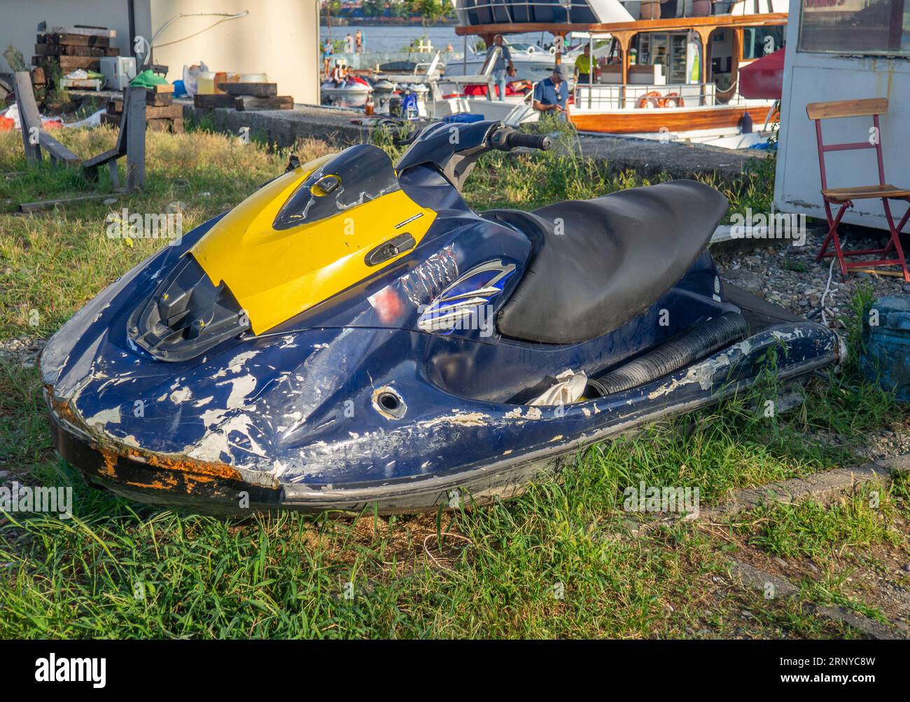 Broken jet ski . Abandoned vehicle. Water bike on the shore. Yacht ...