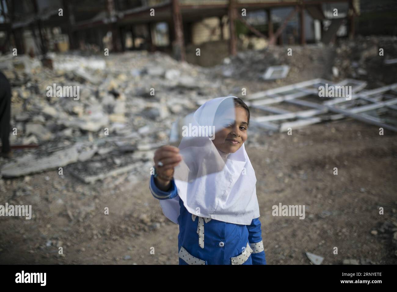 (180315) -- SARPOL-E ZAHAB, March 15, 2018 -- Paria plays amidst the ...