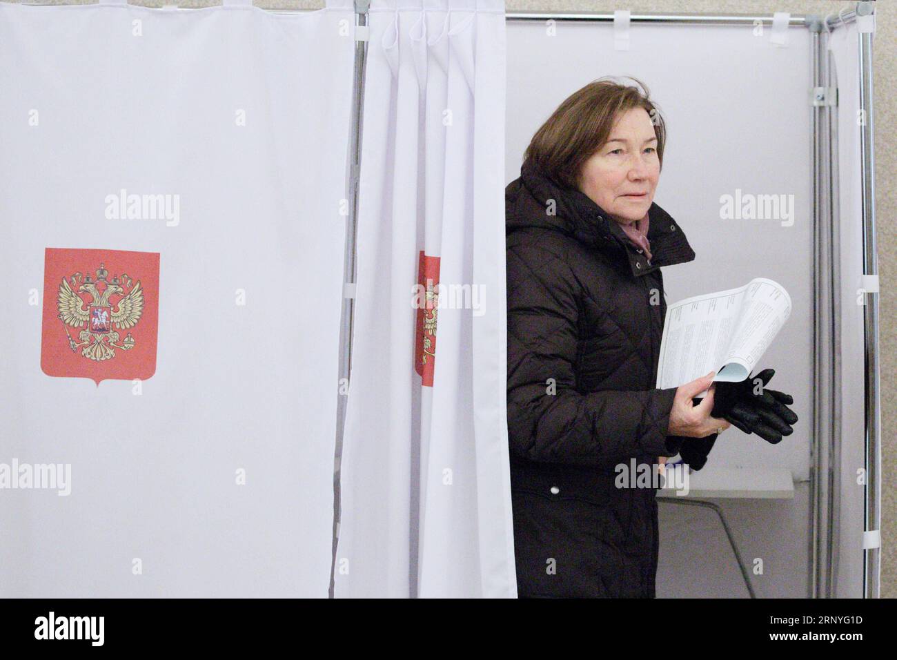 (180318) -- MOSCOW, March 18, 2018 -- A woman walks out of a voting ...
