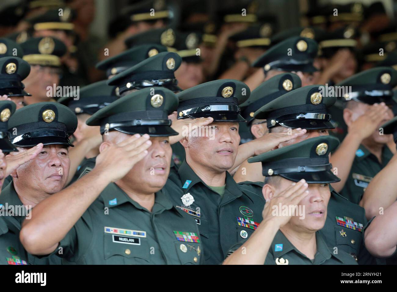 (180320) -- TAGUIG CITY, March 20, 2018 -- Military officers salute ...