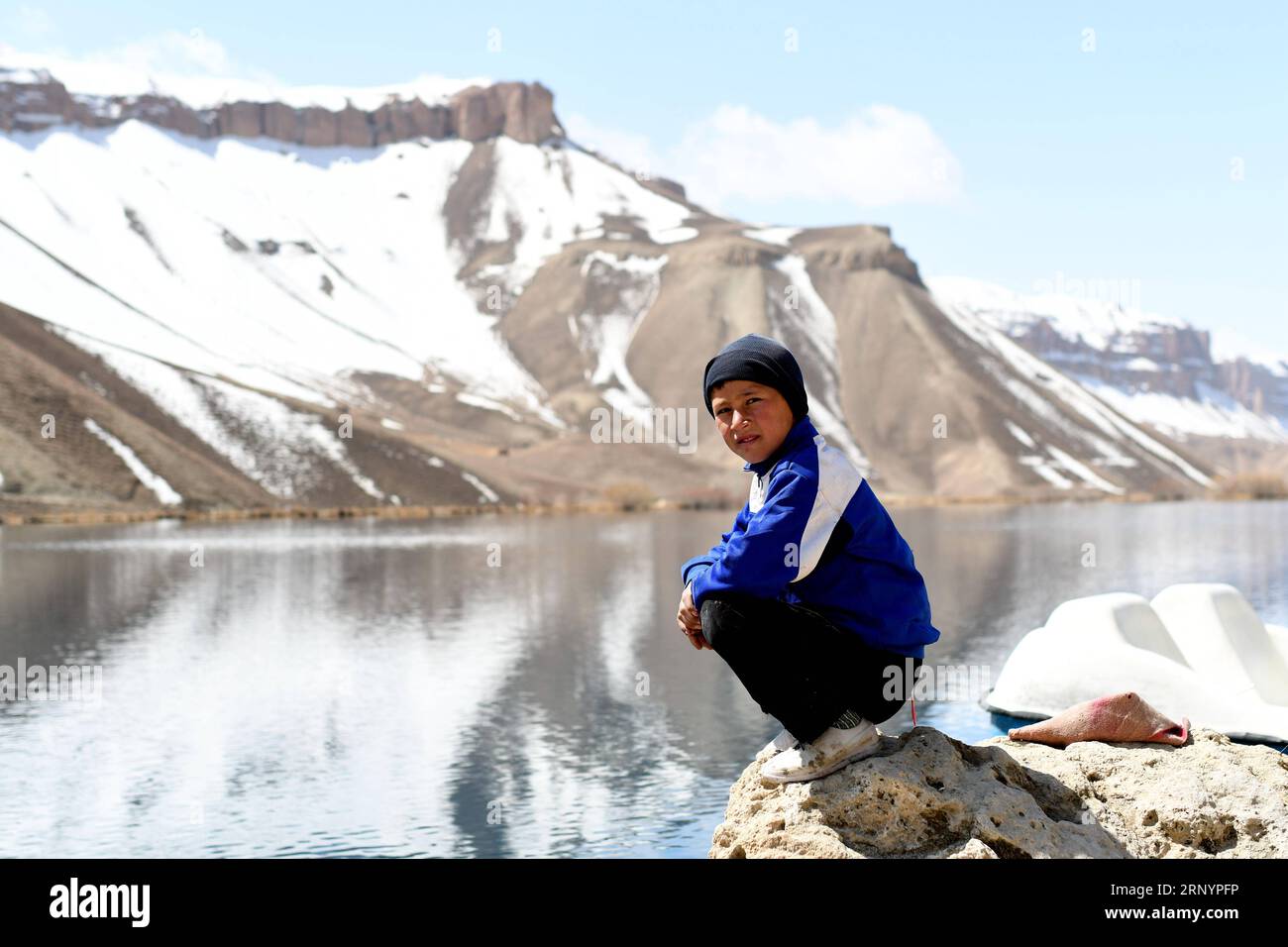 (180329) -- BAMYAN, March 29, 2018 -- A boy squats by the Band-e-Amir ...