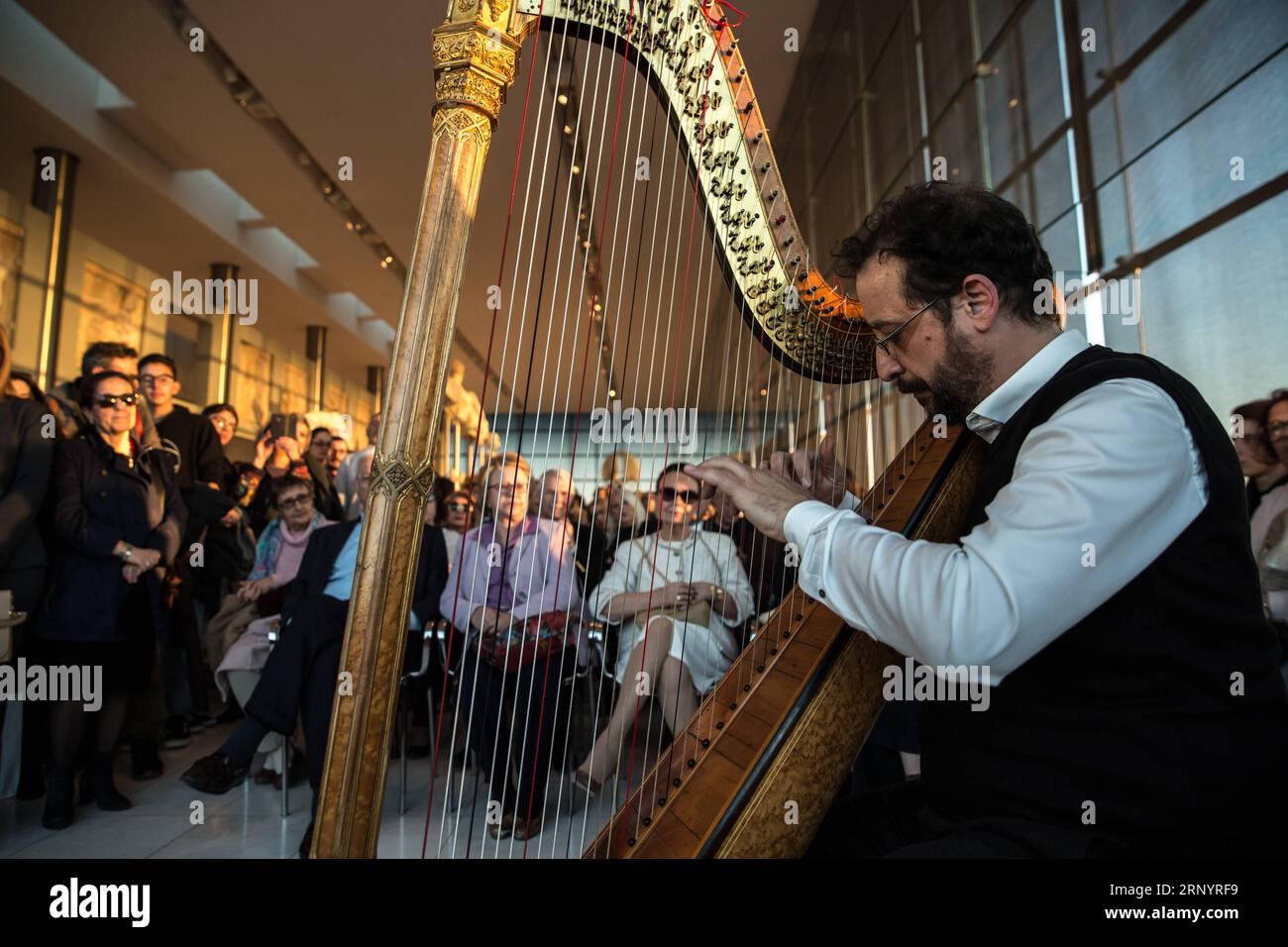 (180331) -- ATHENS, March 31, 2018 -- Visitors enjoy a harp performance ...