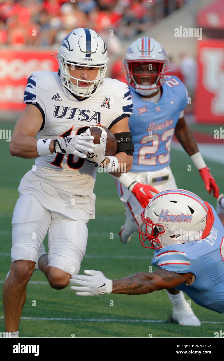 UTSA wide receiver David Amador, left, makes a gain as UTSA defensive ...