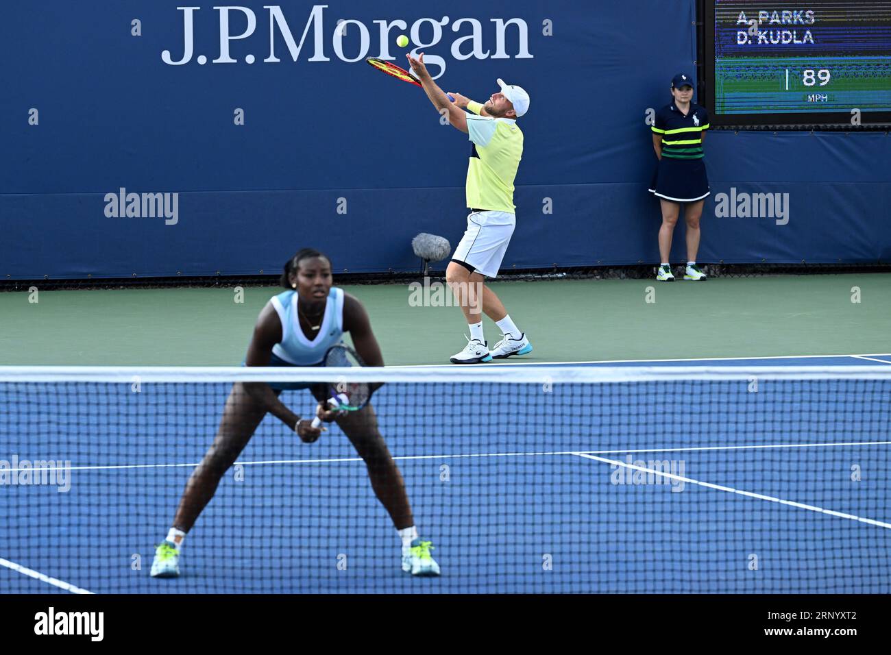 Alycia Parks and Denis Kudla serves during a mixed doubles match at the ...