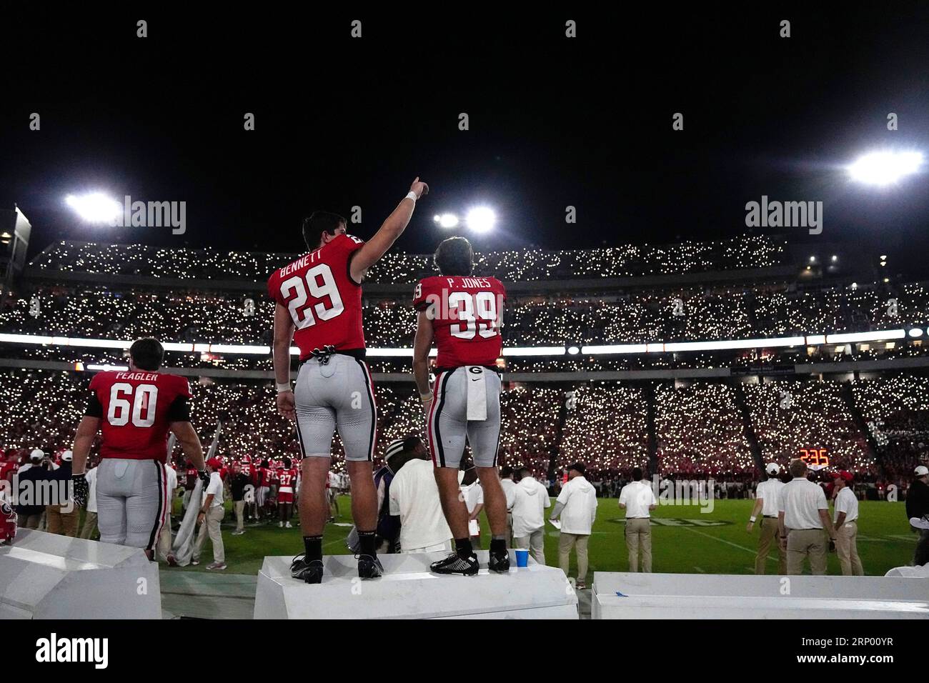 Georgia wide receivers Luke Bennett (29) and Parker Jones (39) stand on ...