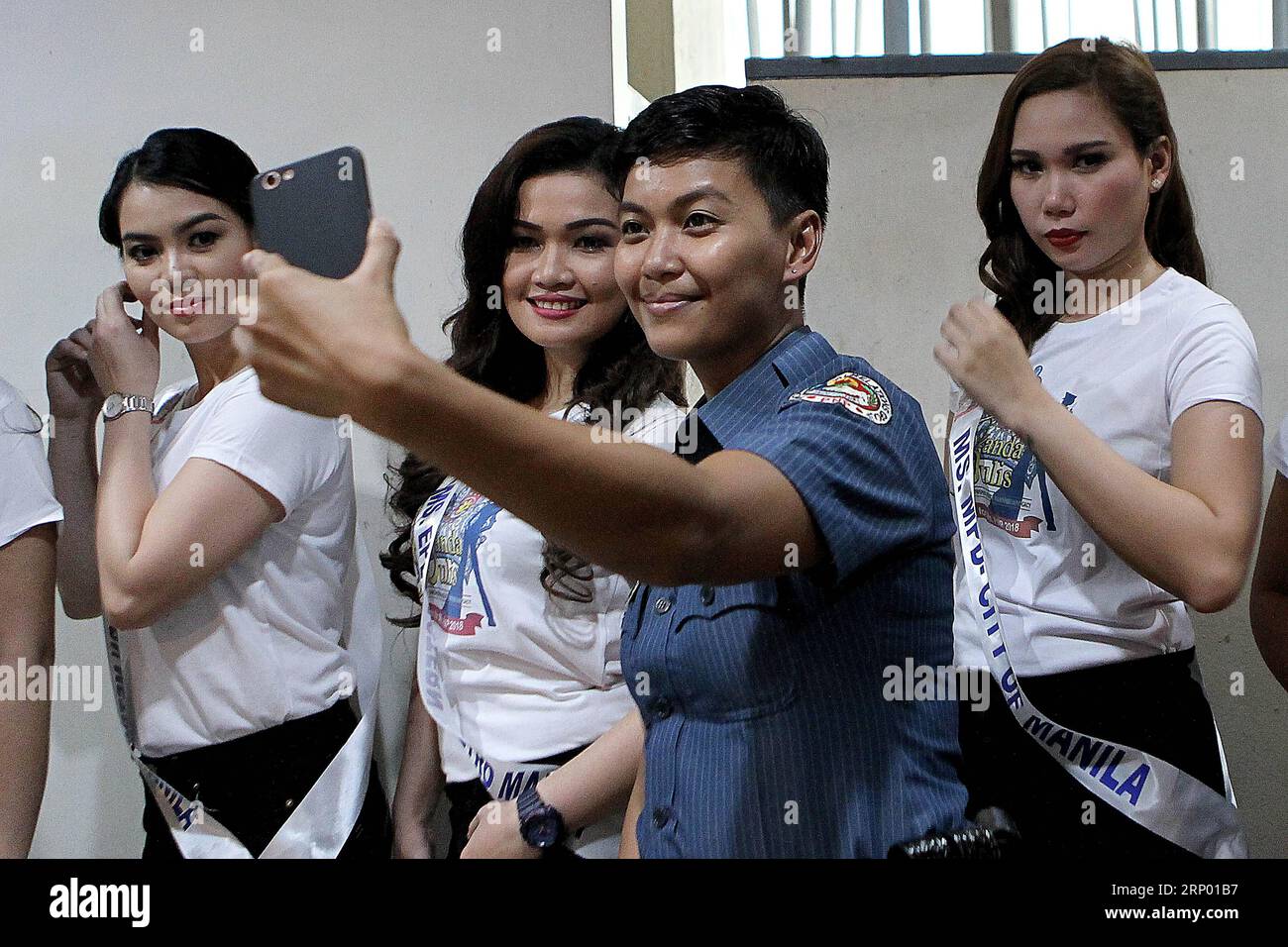 (180412) -- QUEZON CITY, April 12, 2018 -- A policewoman takes a selfie ...