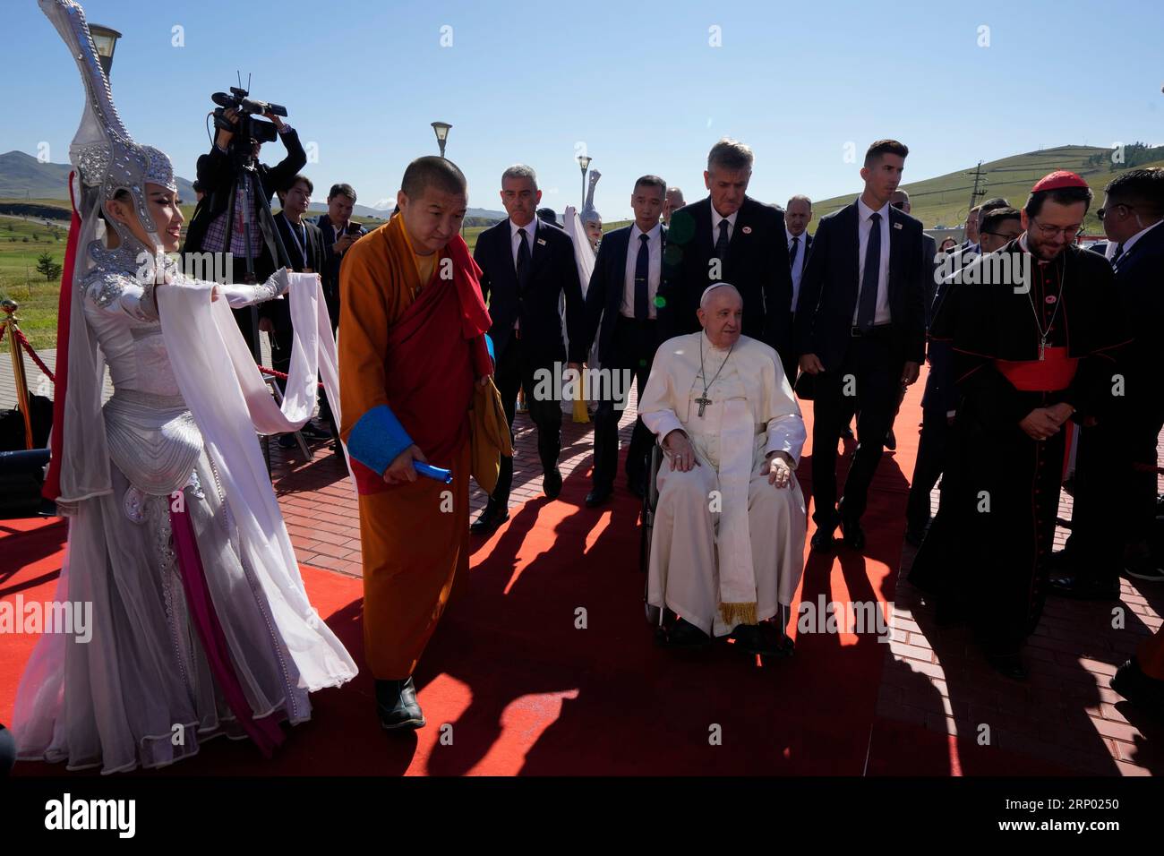 Pope Francis arrives at a meeting with religious leaders at the Hun ...