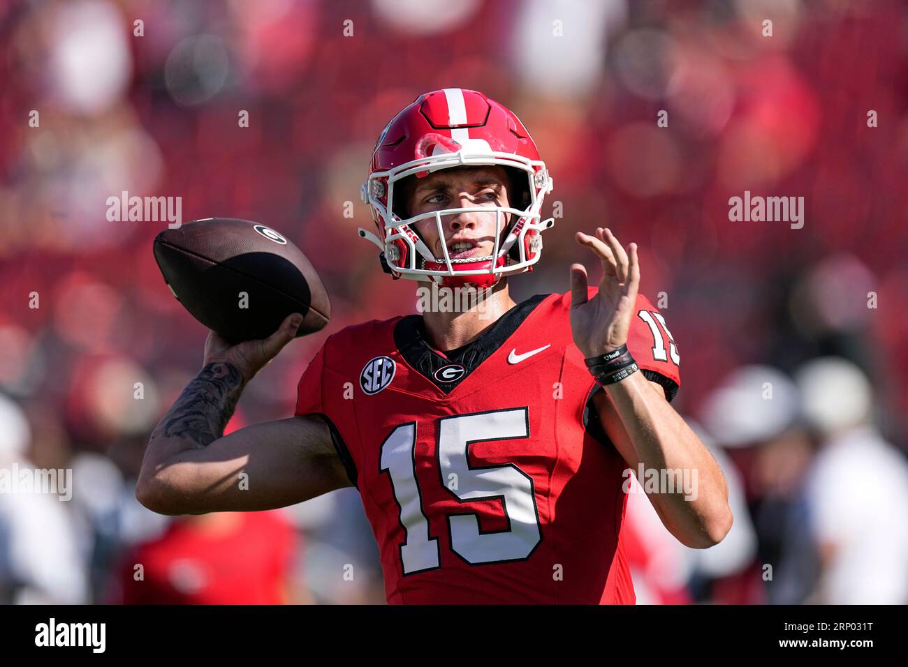 Georgia quarterback Carson Beck (15) warms up before an NCAA college ...