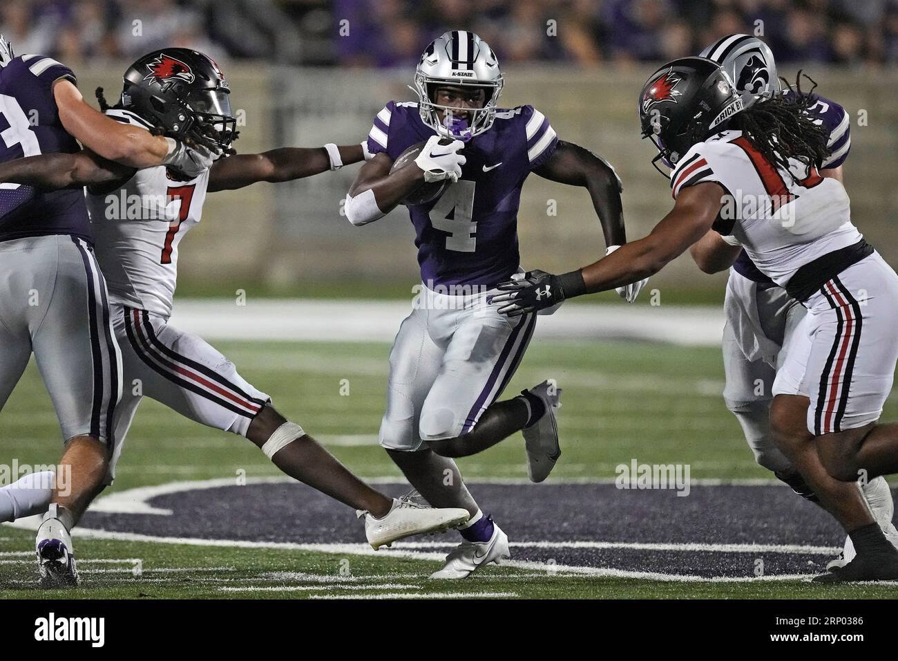 Kansas State running back Joe Jackson (4) runs between Southeast ...