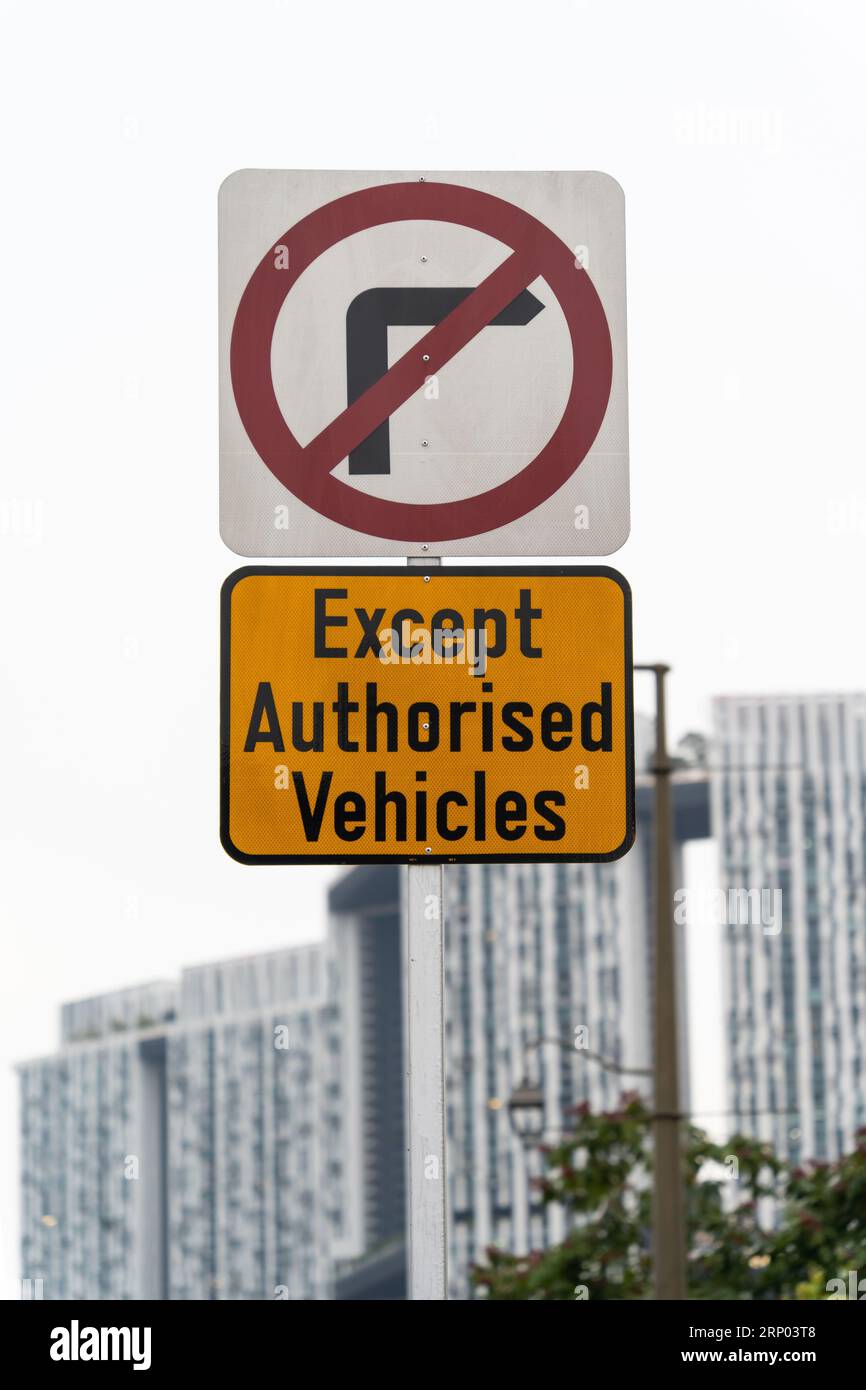 "Do not turn right" except authorised vehicles sign Stock Photo - Alamy