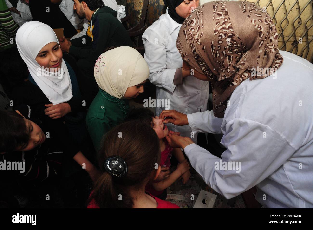 (180418) -- DAMASCUS, April 18, 2018 -- A nurse gives vaccines to ...