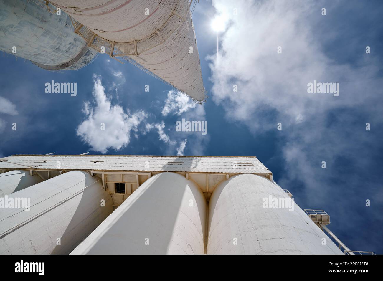 Brick chimney and concrete silos for limestone storage Stock Photo - Alamy