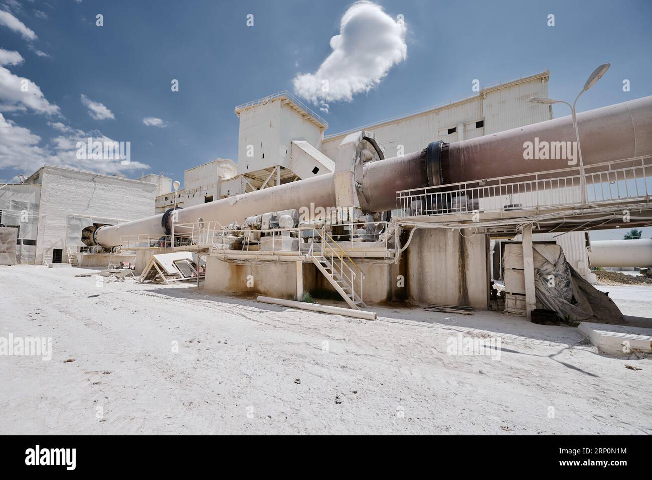 Tubular rotary furnace and smoking chimney at factory Stock Photo - Alamy