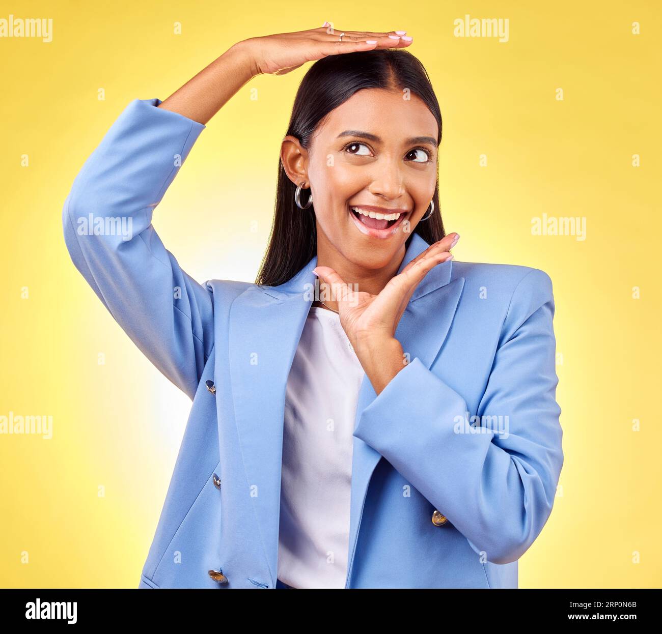 Happy, business and hands of woman frame face in studio yellow background for creative ...