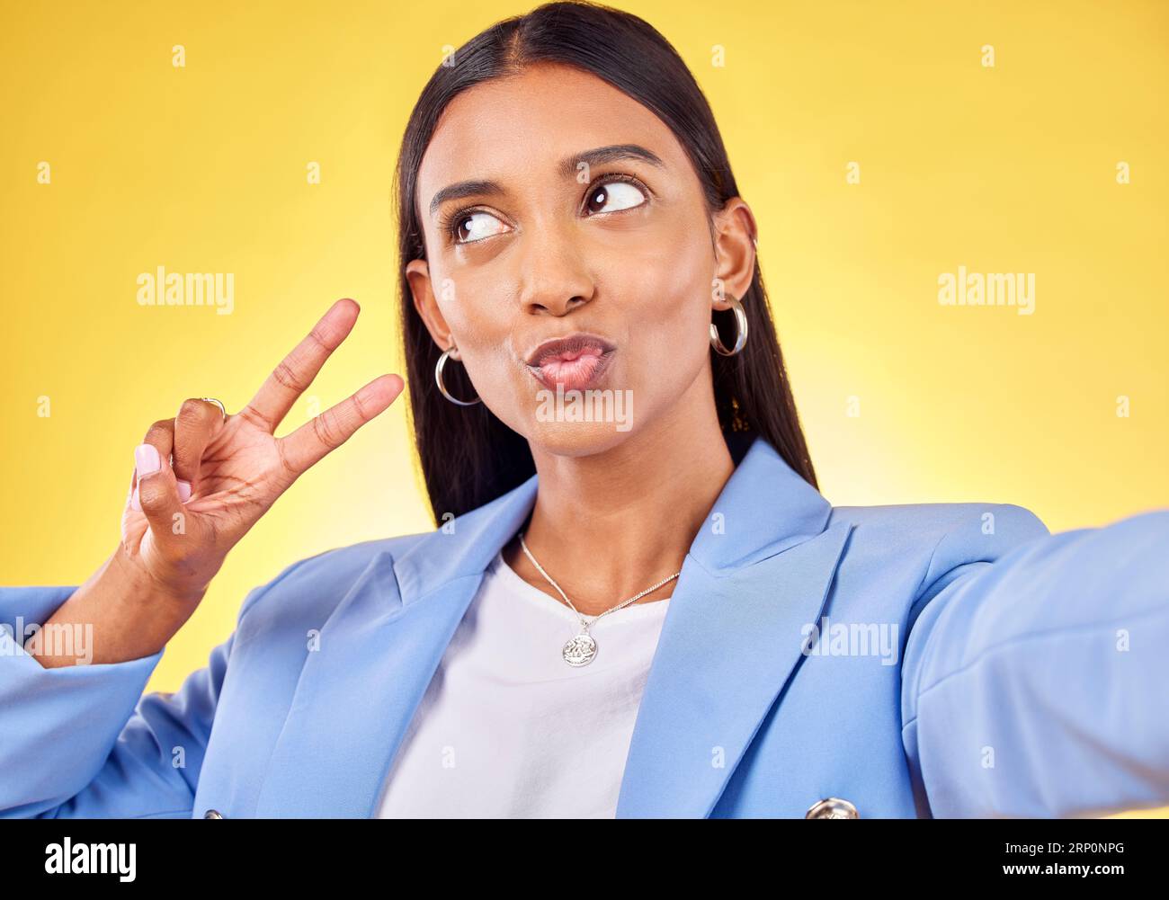 Business woman, peace sign and studio selfie with funny face, pouting and emoji by yellow ...