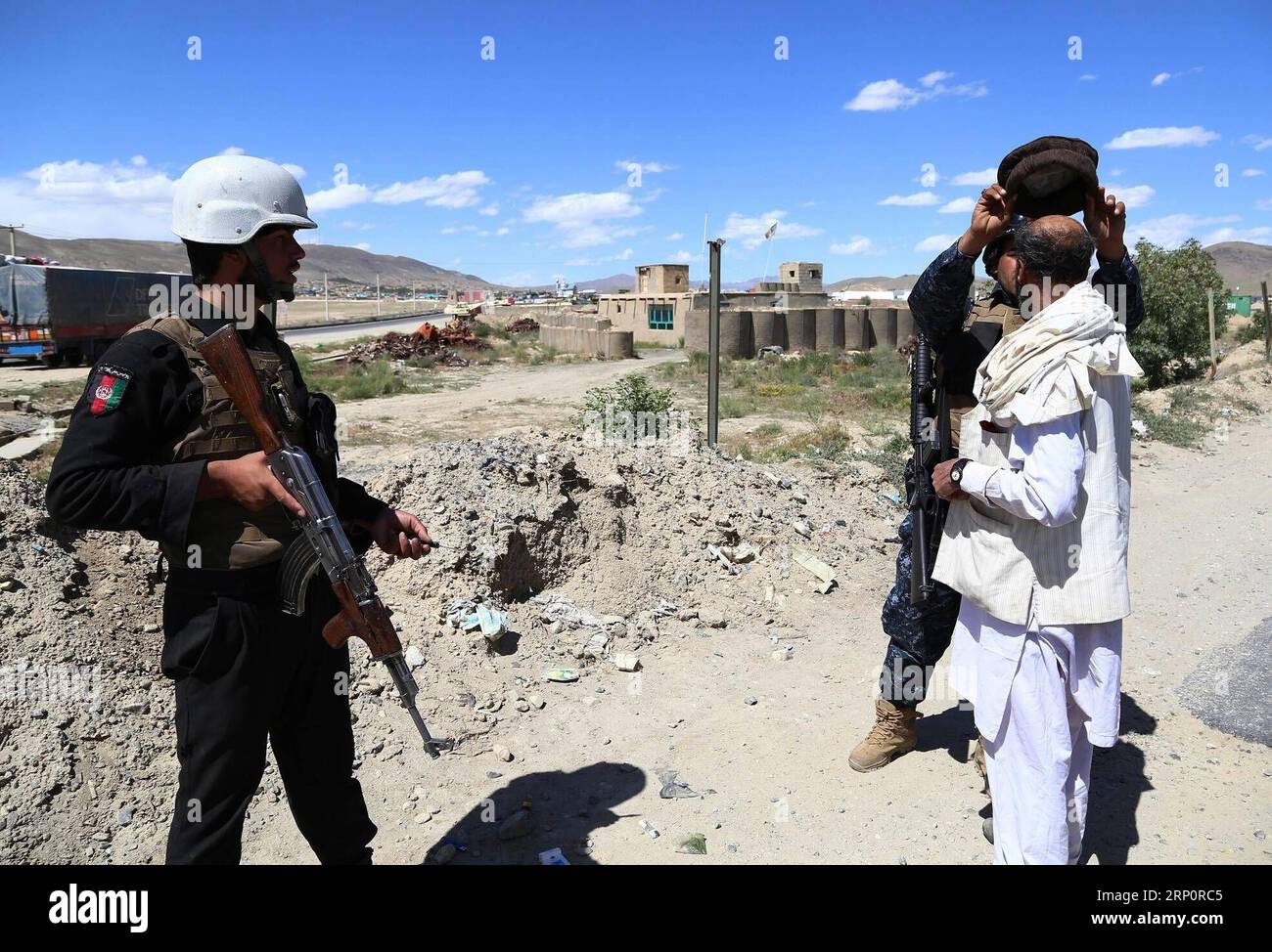 (180523) -- GHAZNI, May 23, 2018 -- Afghan security members search a ...