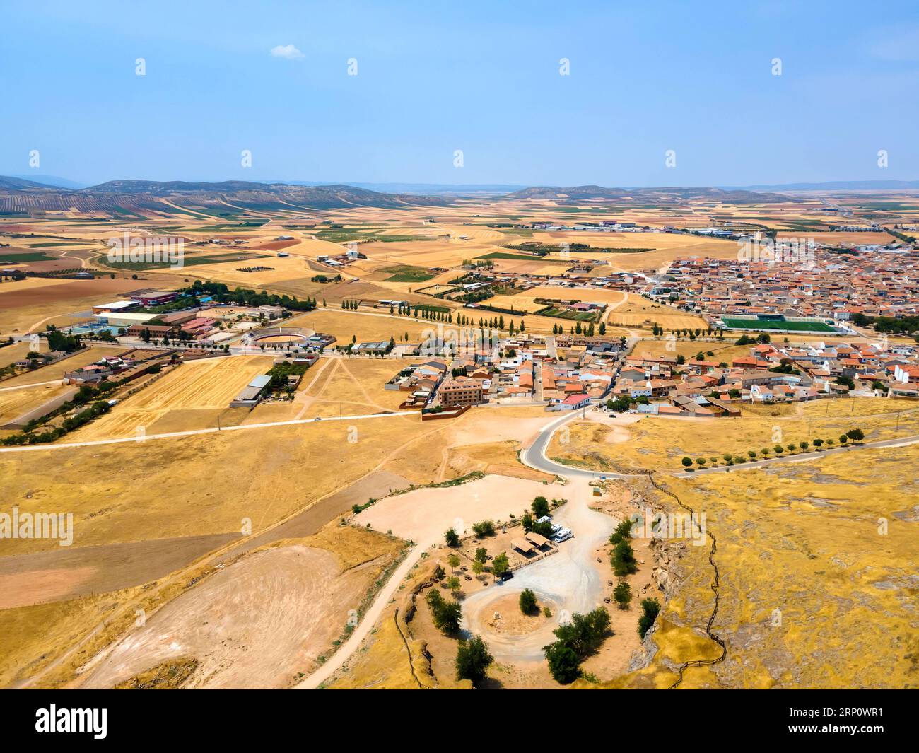 An aerial view of Consuegra and surrounding agricultural landscape, La ...