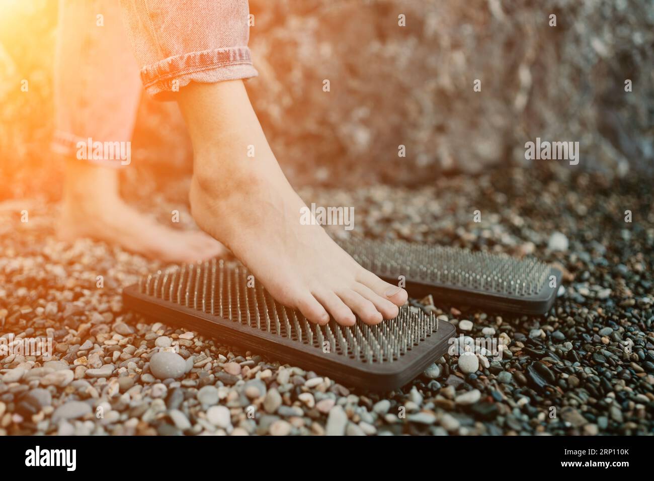 Sea Woman feet stepping on sadhu board during indian practice on the ...