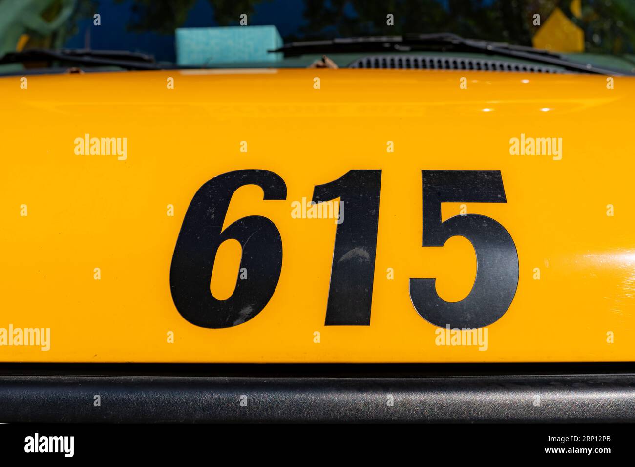 Front of a parked yellow school bus number 615 Stock Photo - Alamy