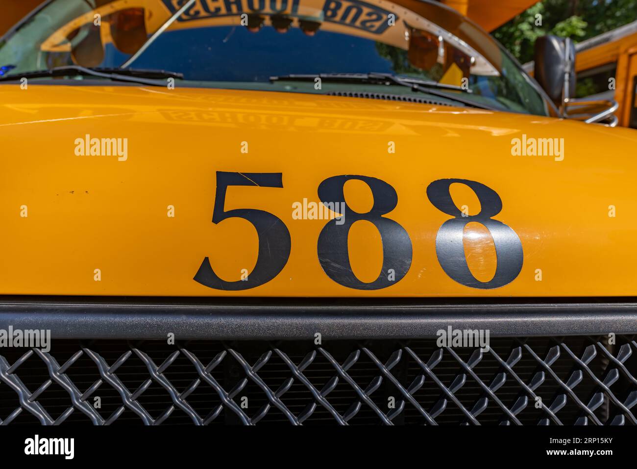 Front of a parked yellow school bus number 588 Stock Photo - Alamy