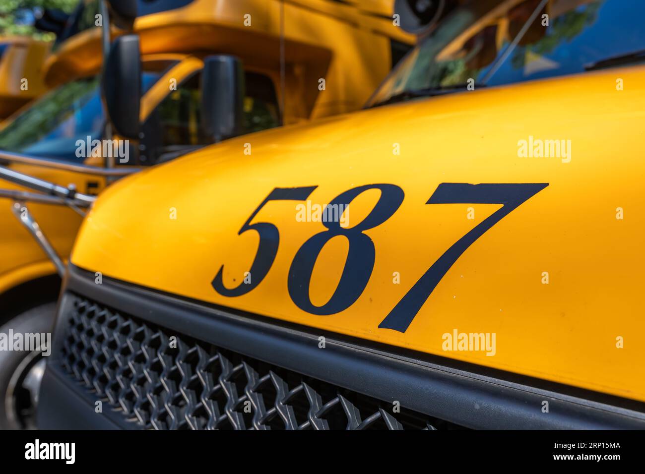 Front of a parked yellow school bus number 587 Stock Photo - Alamy