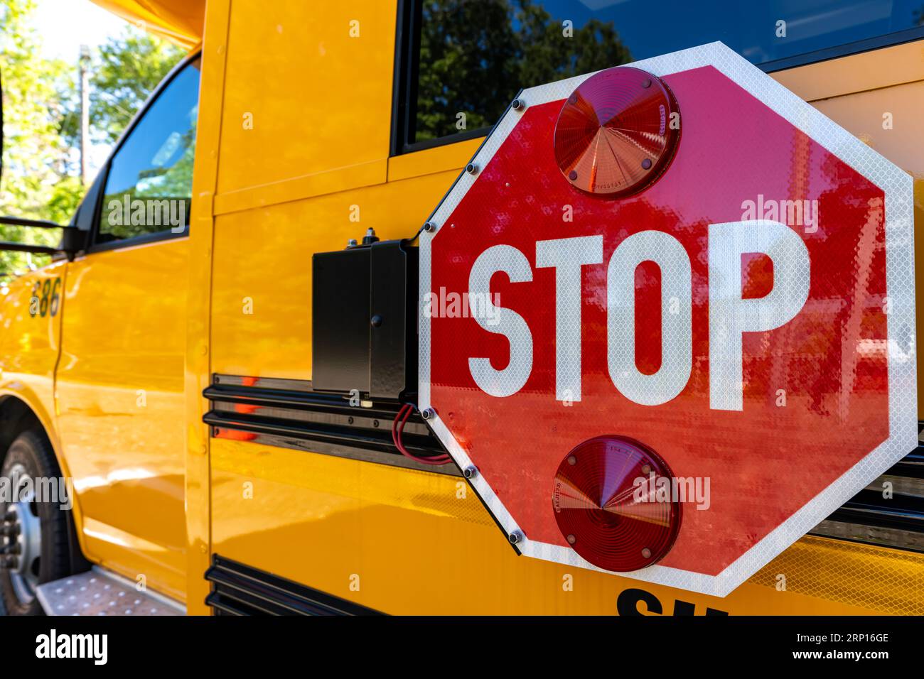 Side of a parked yellow school bus Stock Photo - Alamy