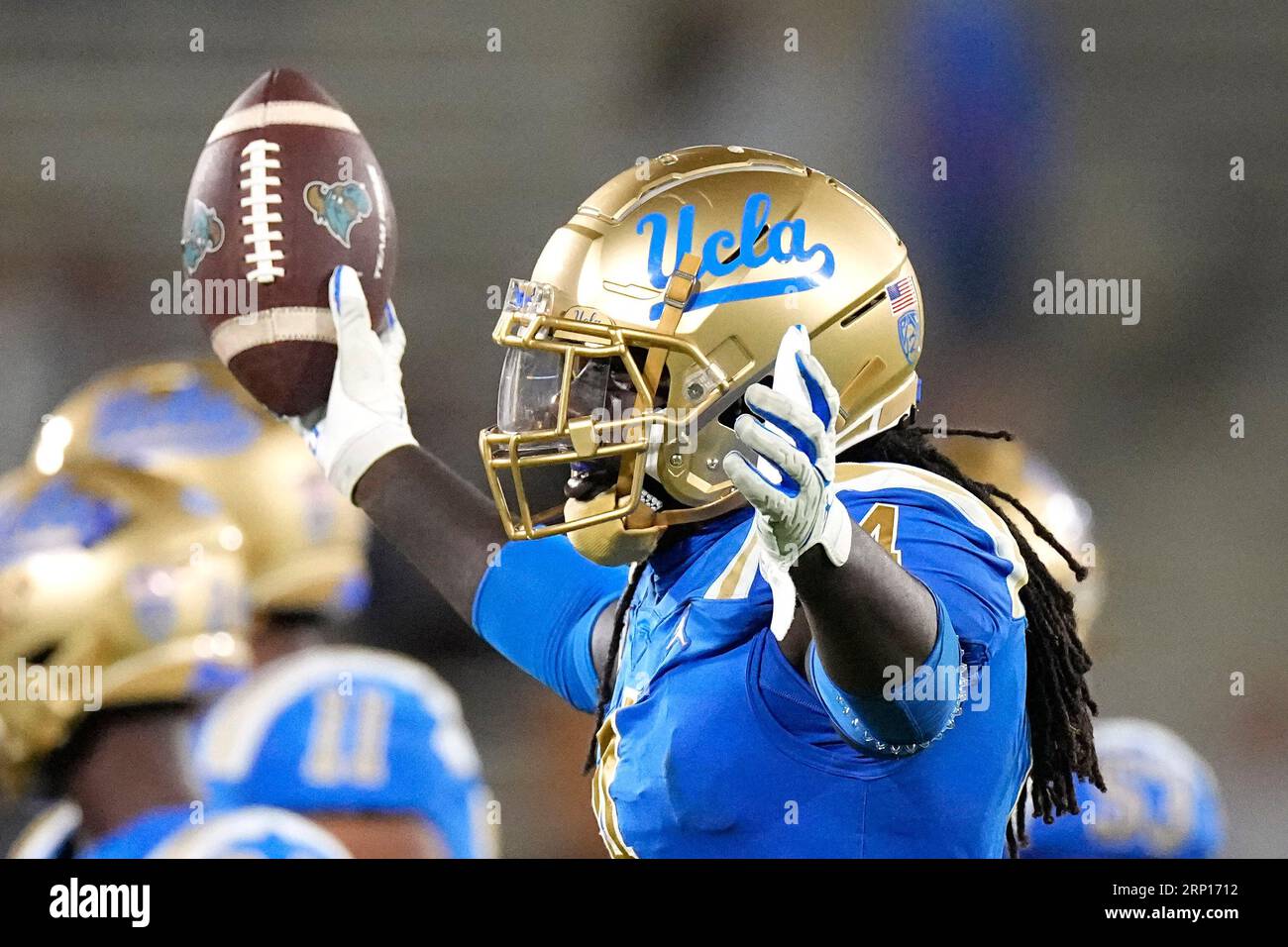 UCLA defensive lineman Carl Jones Jr. celebrates after a fumble ...