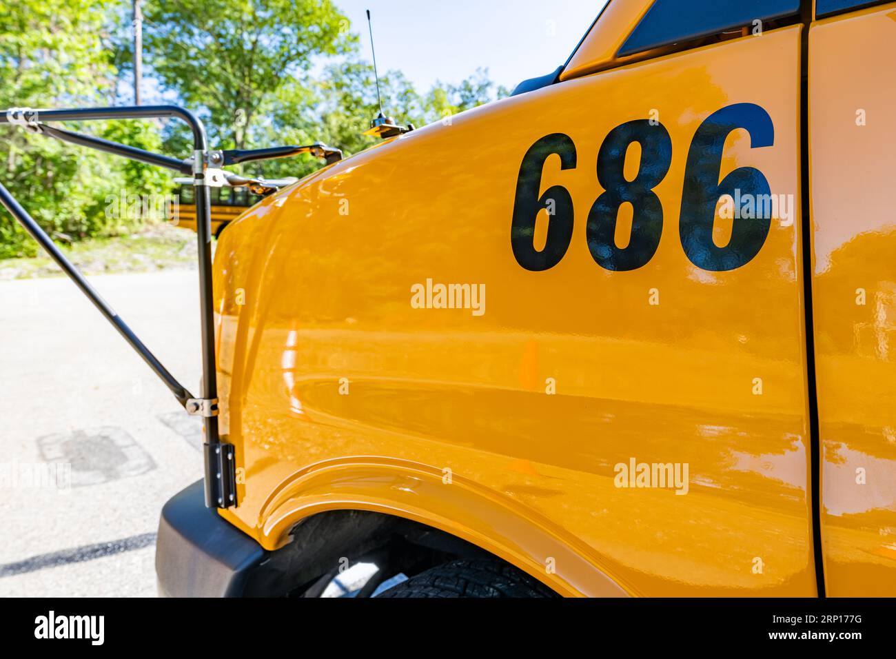 Side of a parked yellow school bus number 686 Stock Photo - Alamy