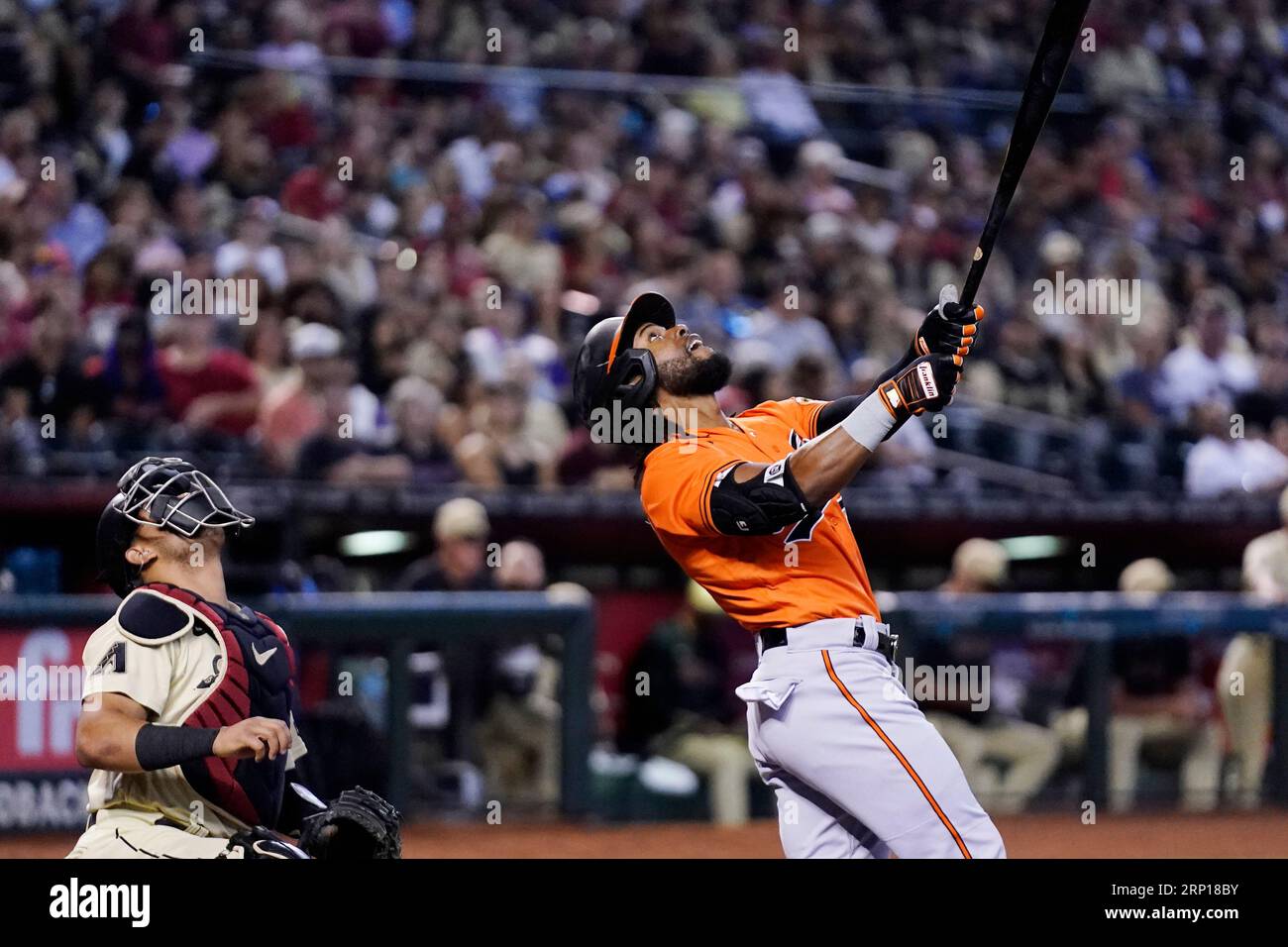Baltimore Orioles' Cedric Mullins, right, and Arizona Diamondbacks ...