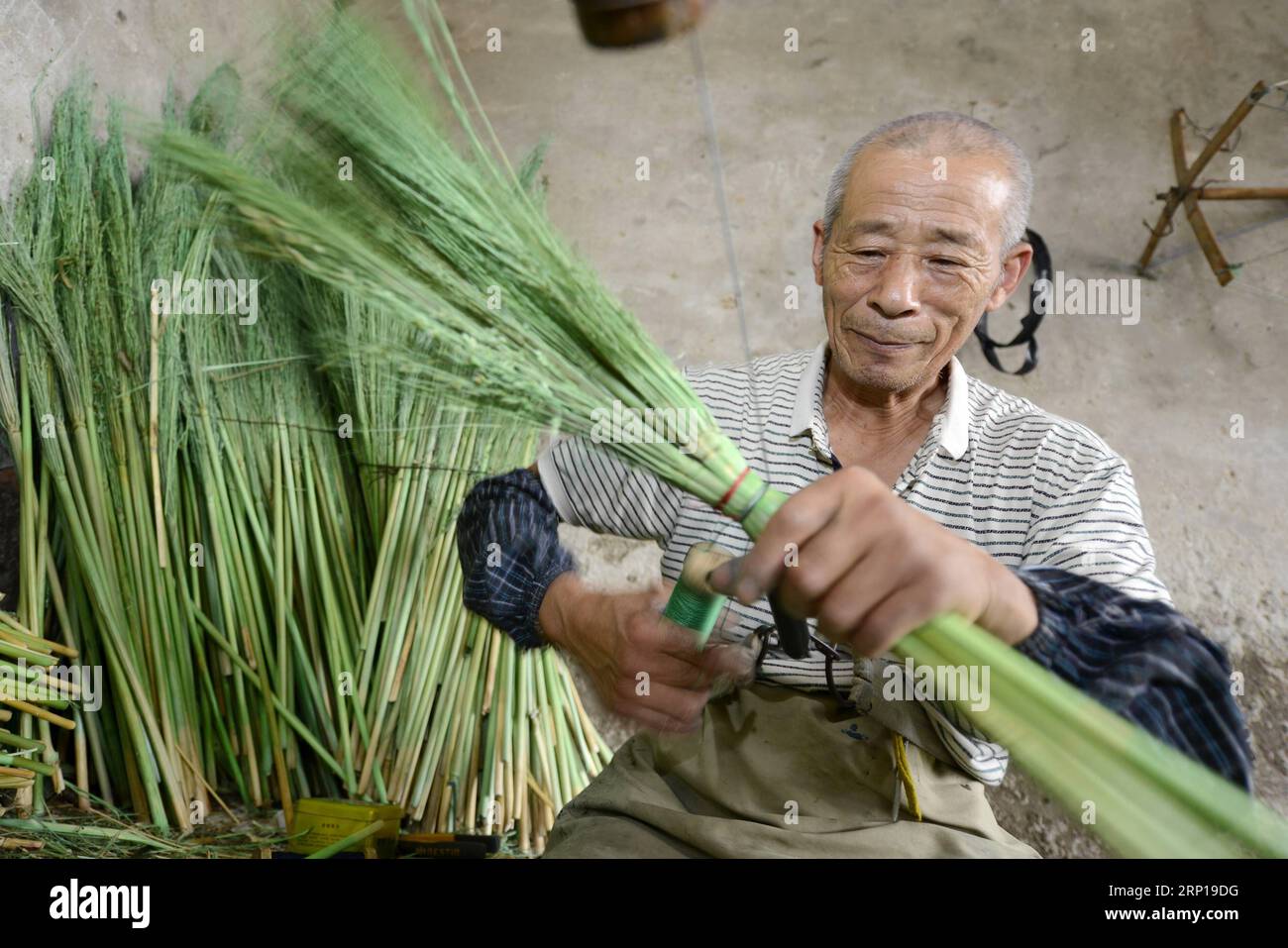 Man with a broom hi-res stock photography and images - Alamy