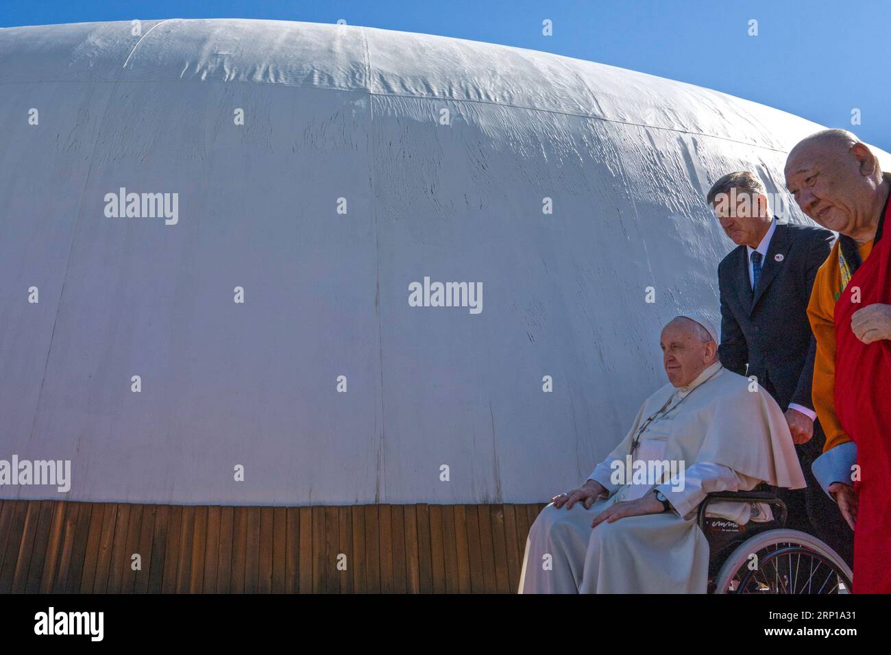 Pope Francis, right, arrives at a meeting with religious leaders at the ...