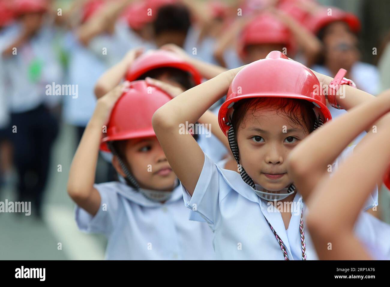 (180621) -- RIZAL, June 21, 2018 -- Students wearing hard hats return ...