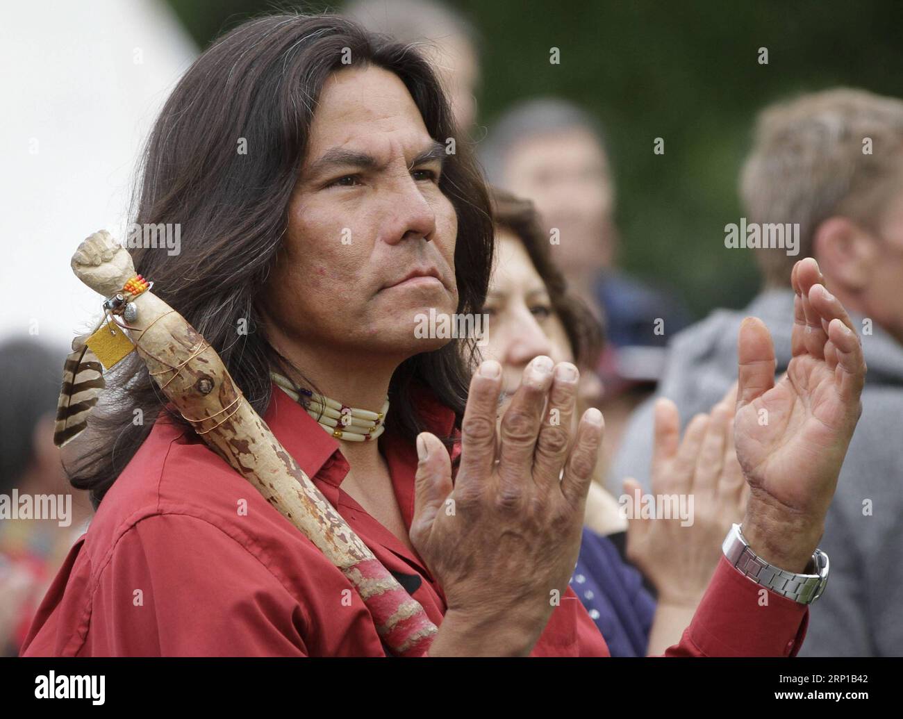 (180622) -- VANCOUVER, June 22, 2018 -- An indigenous man raises his ...