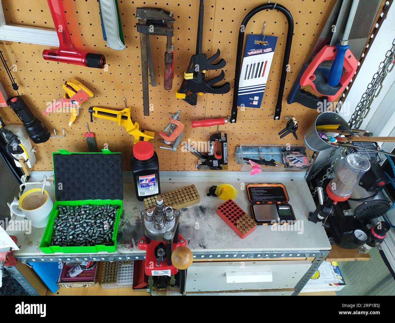 A closeup of the pistol ammunition reloading process Stock Photo - Alamy