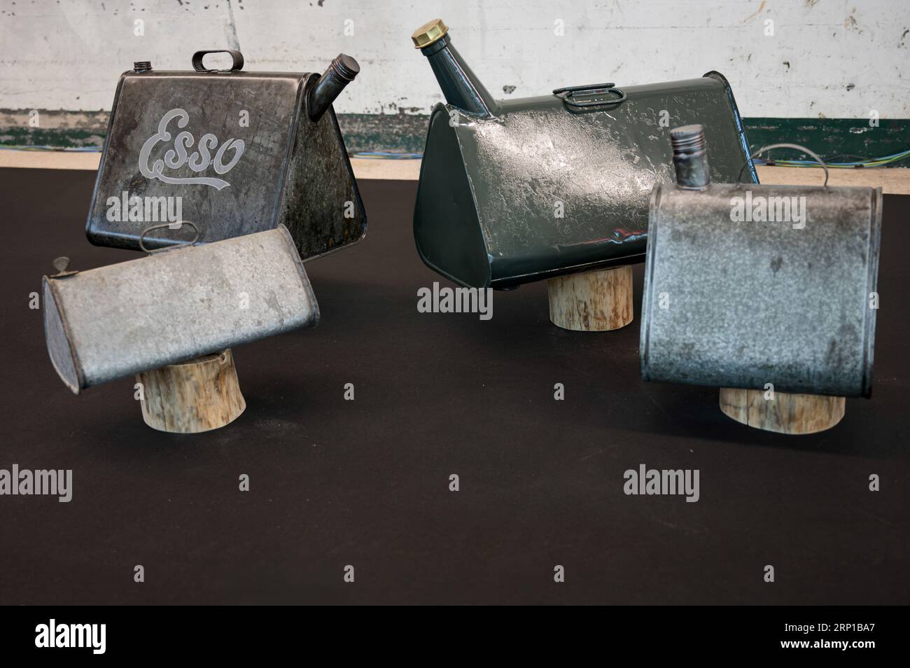 The small and old gasoline cans of the ESSO brand Stock Photo - Alamy