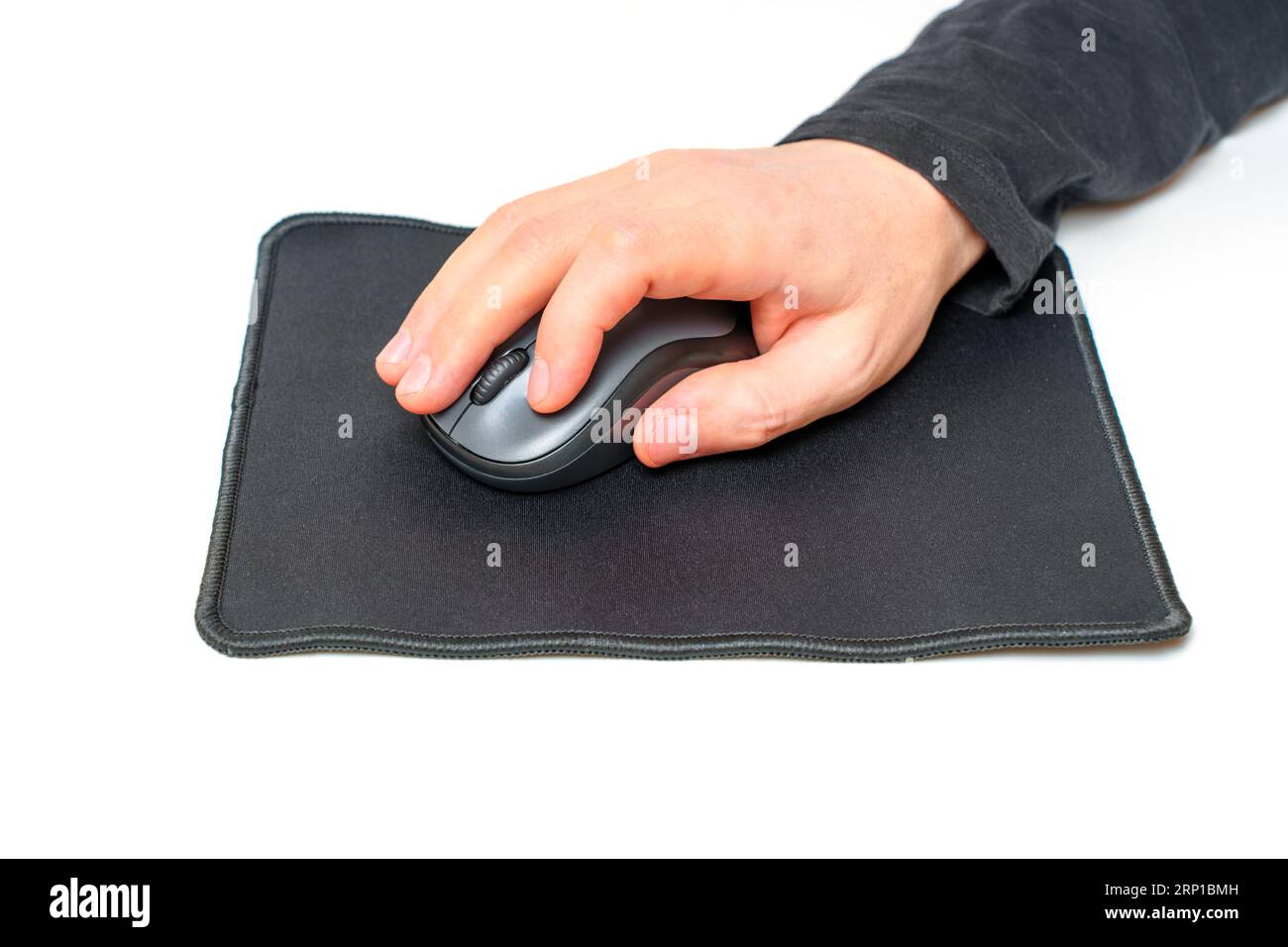 Male hand uses a computer mouse resting on a brand new and fresh mouse ...
